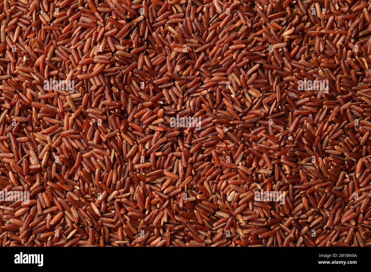 Brown rice texture background, close up and macro Stock Photo - Alamy