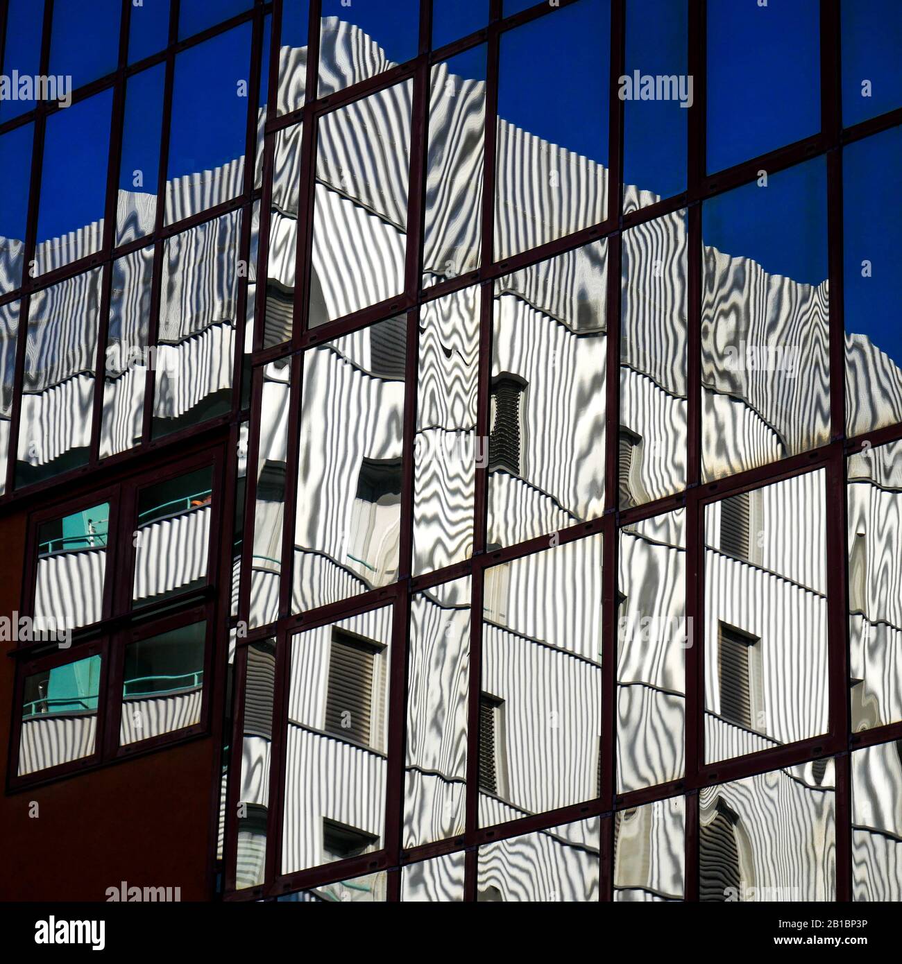 Buildings reflecting themselves in a glass facade, La Part-Dieu, Lyon ...