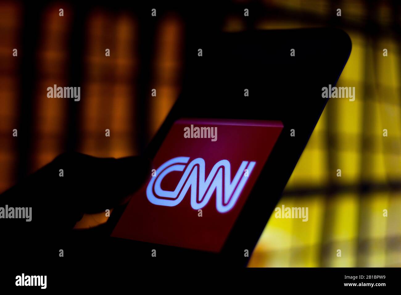 In this photo illustration a CNN logo seen displayed on a smartphone ...