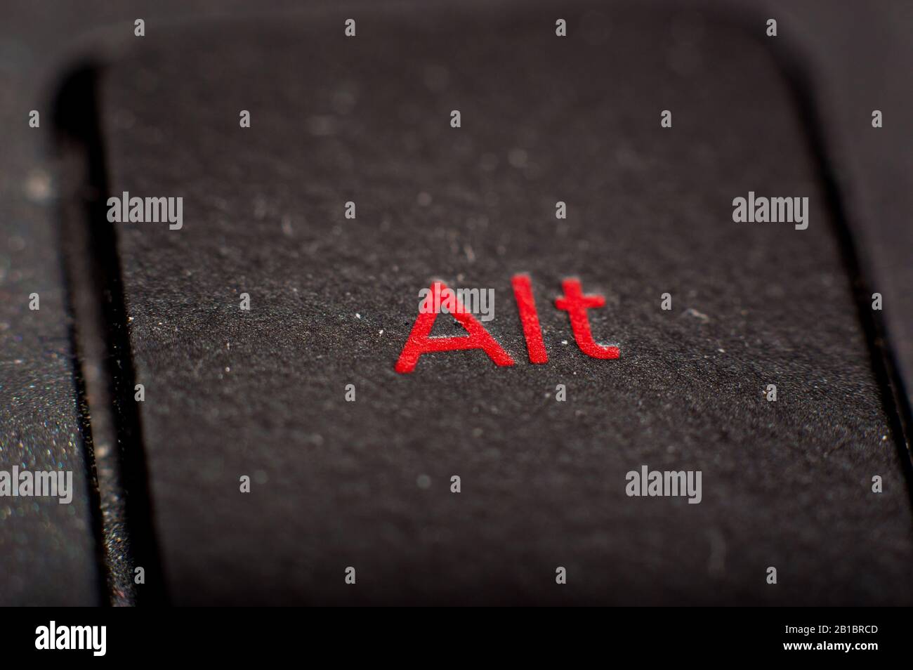 Red lit ALT key on a black keyboard Stock Photo - Alamy