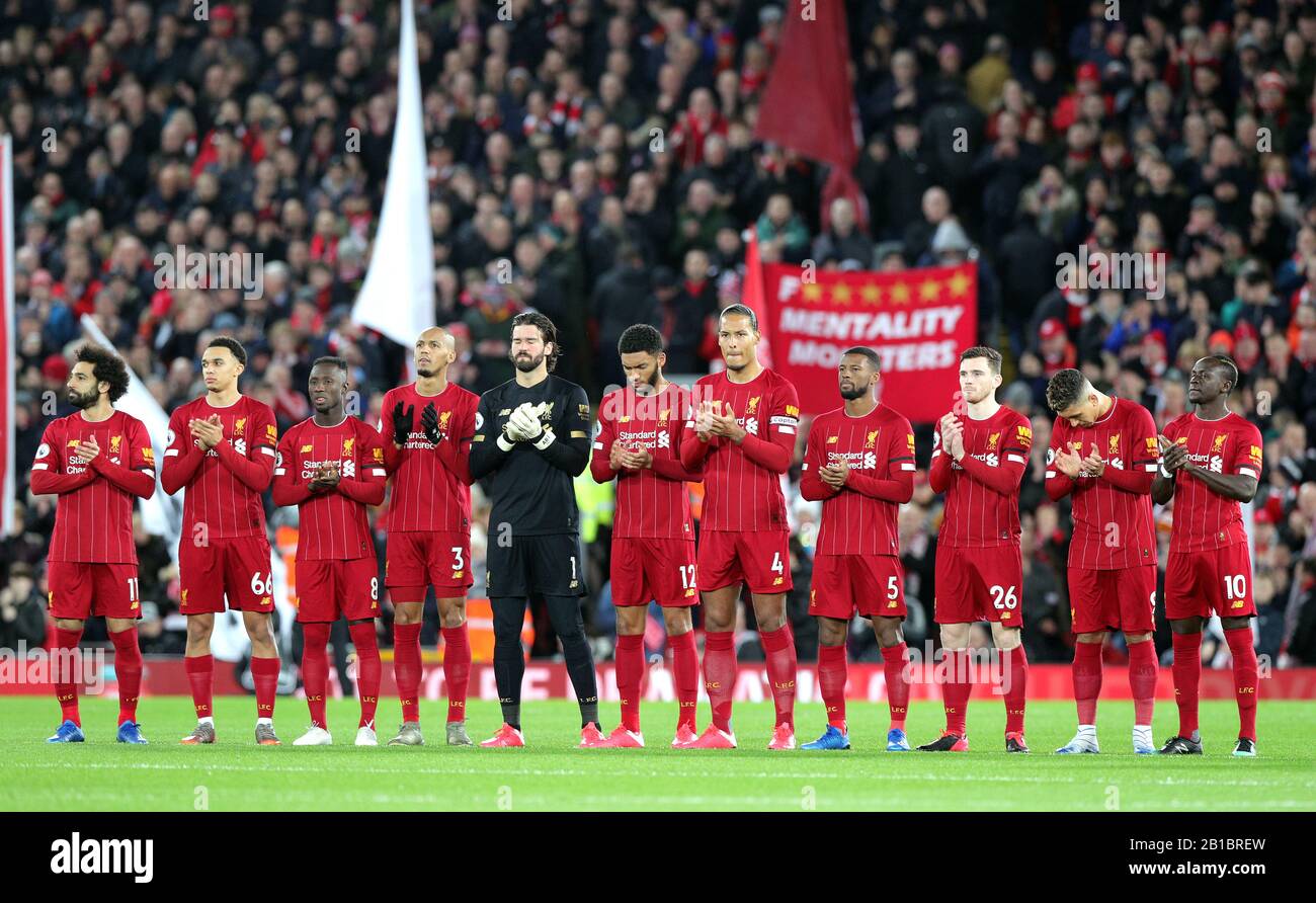 Liverpool players take part in a minute's applause for the late Brian ...