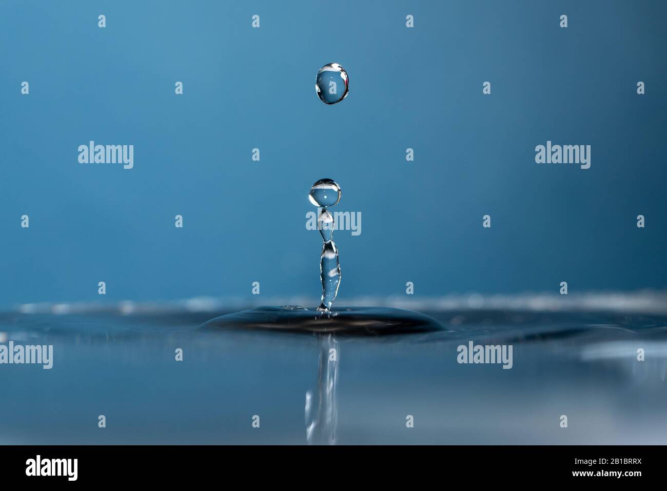 Water Drop falling making droplet splash and waves clean and fresh ...