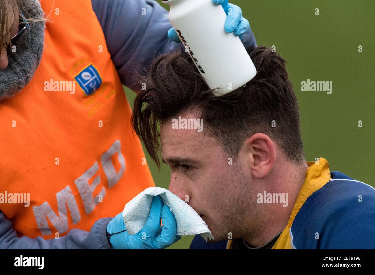 An amateur rugby union club football player receiving medical treatment ...