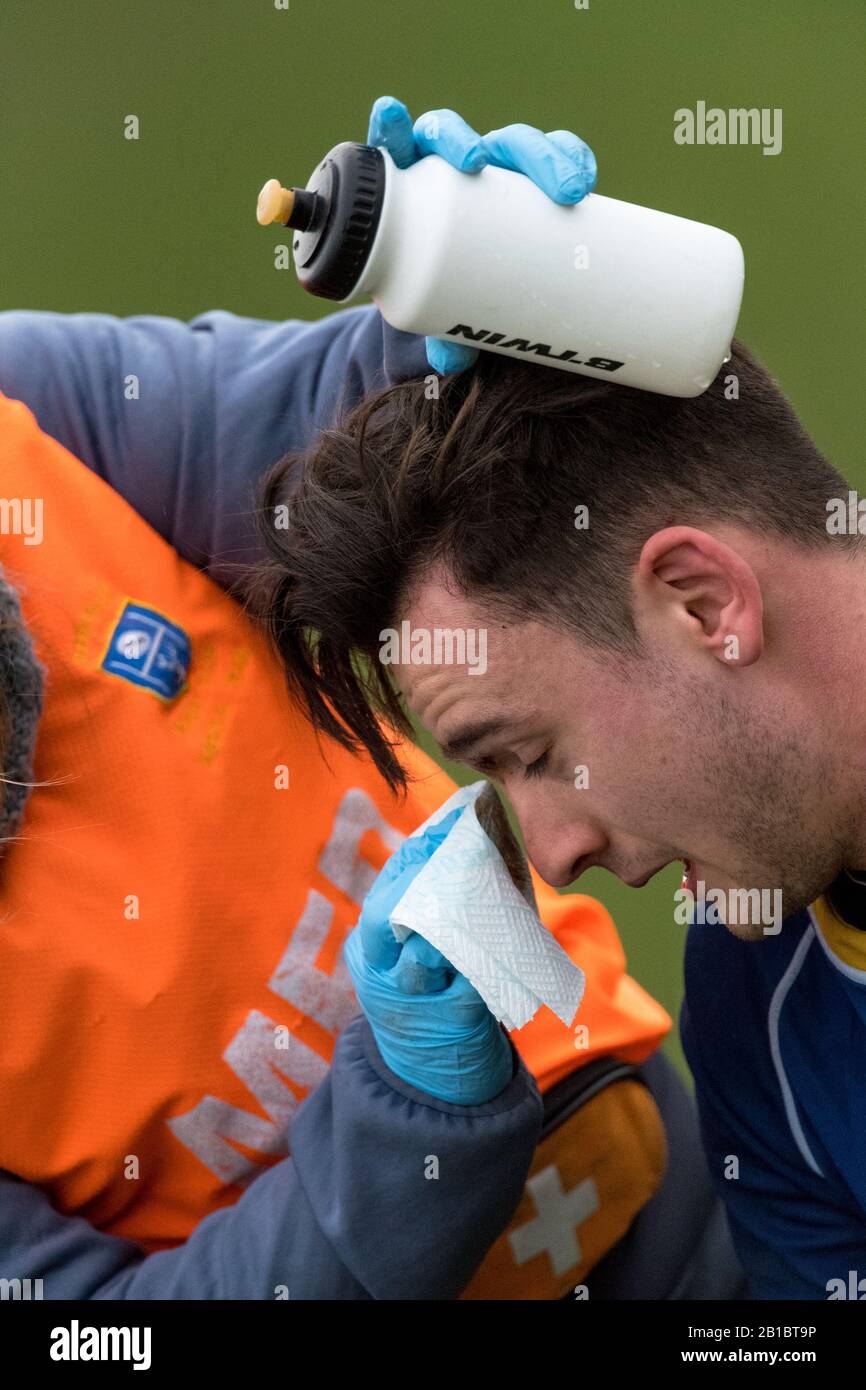 An amateur rugby union club football player receiving medical treatment ...