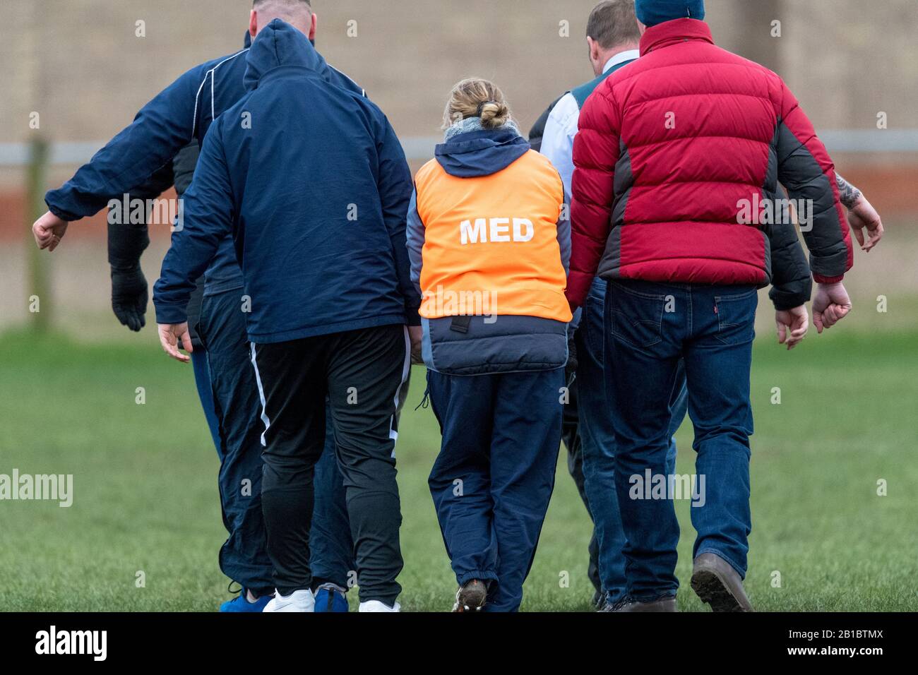 An amateur rugby union club football player being stretchered off ...