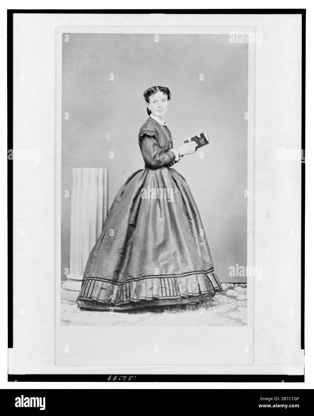 Standing woman facing right Black and White Stock Photos & Images - Alamy