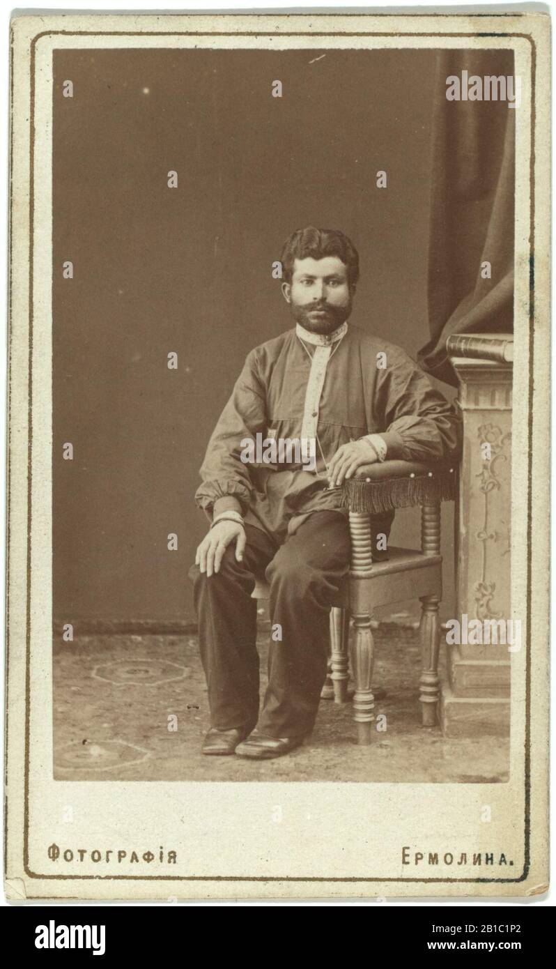 Full-length portrait of Armenian man, seated, facing front Stock Photo ...