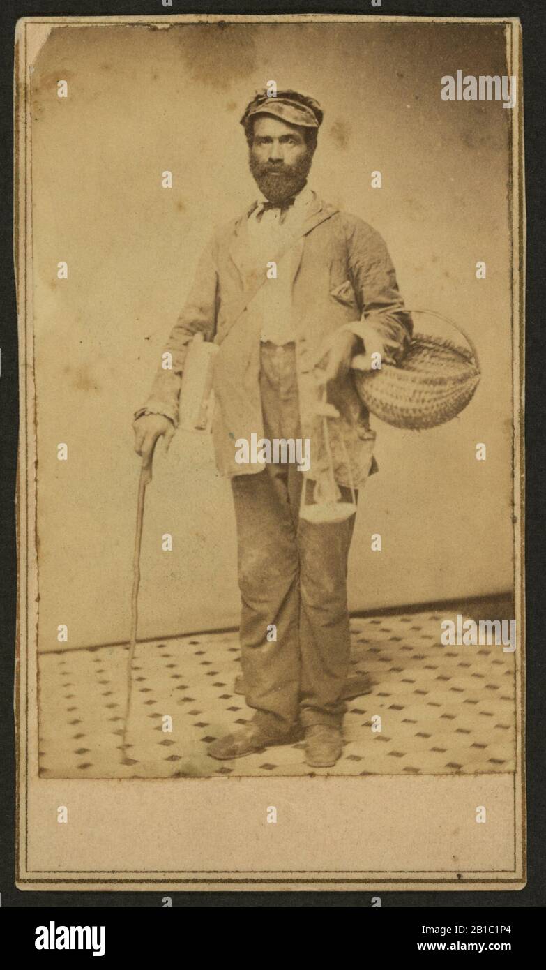 Full-length portrait of an African American man with a basket and a ...