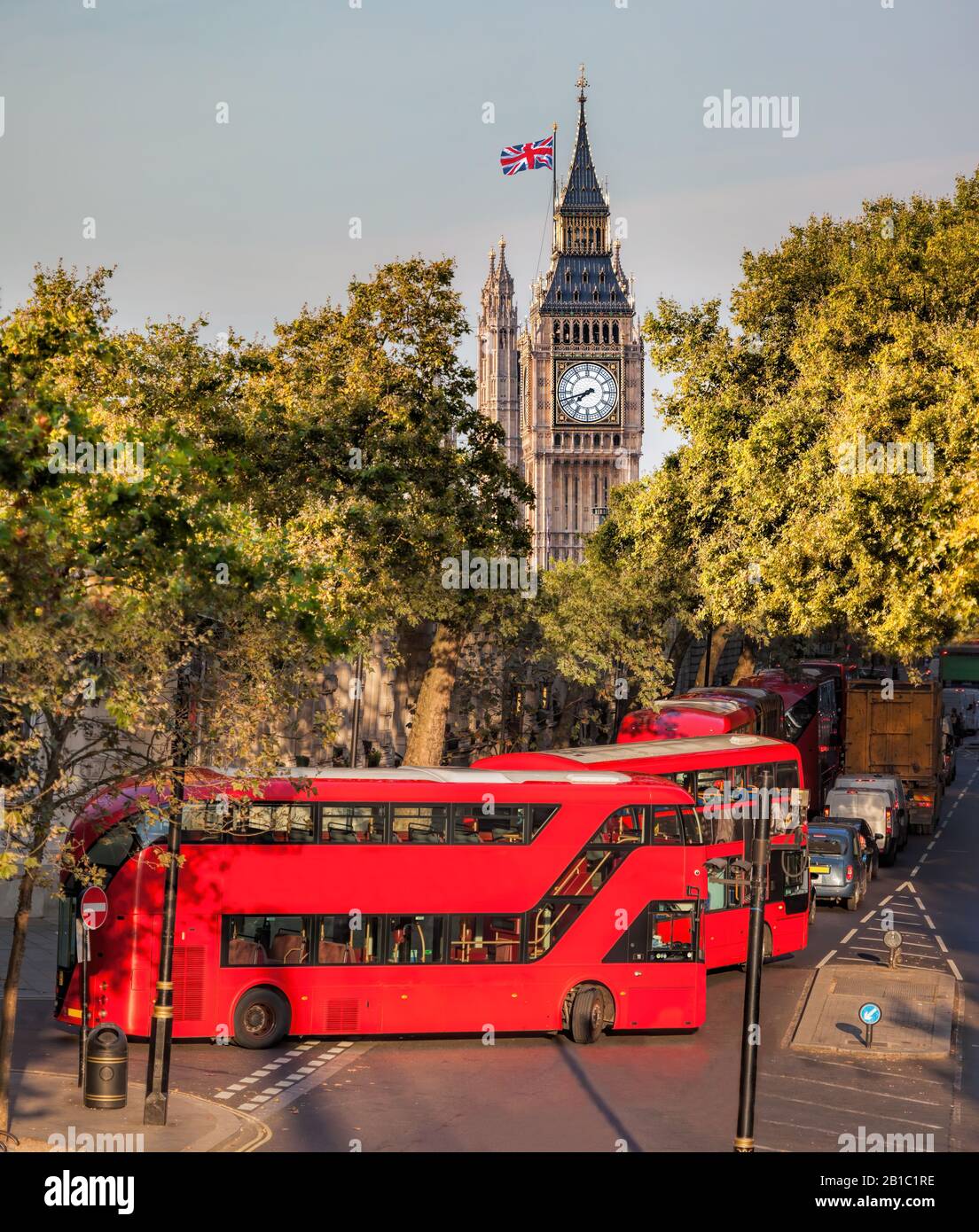 Big Ben with red buses in London, England, UK Stock Photo - Alamy