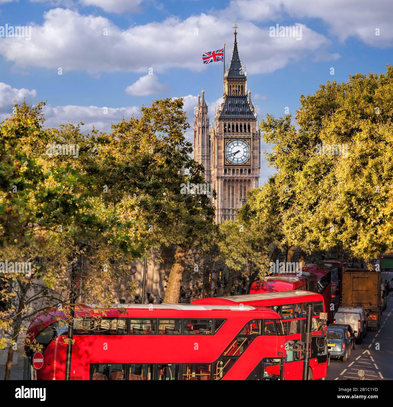 Big Ben with red buses in London, England, UK Stock Photo - Alamy