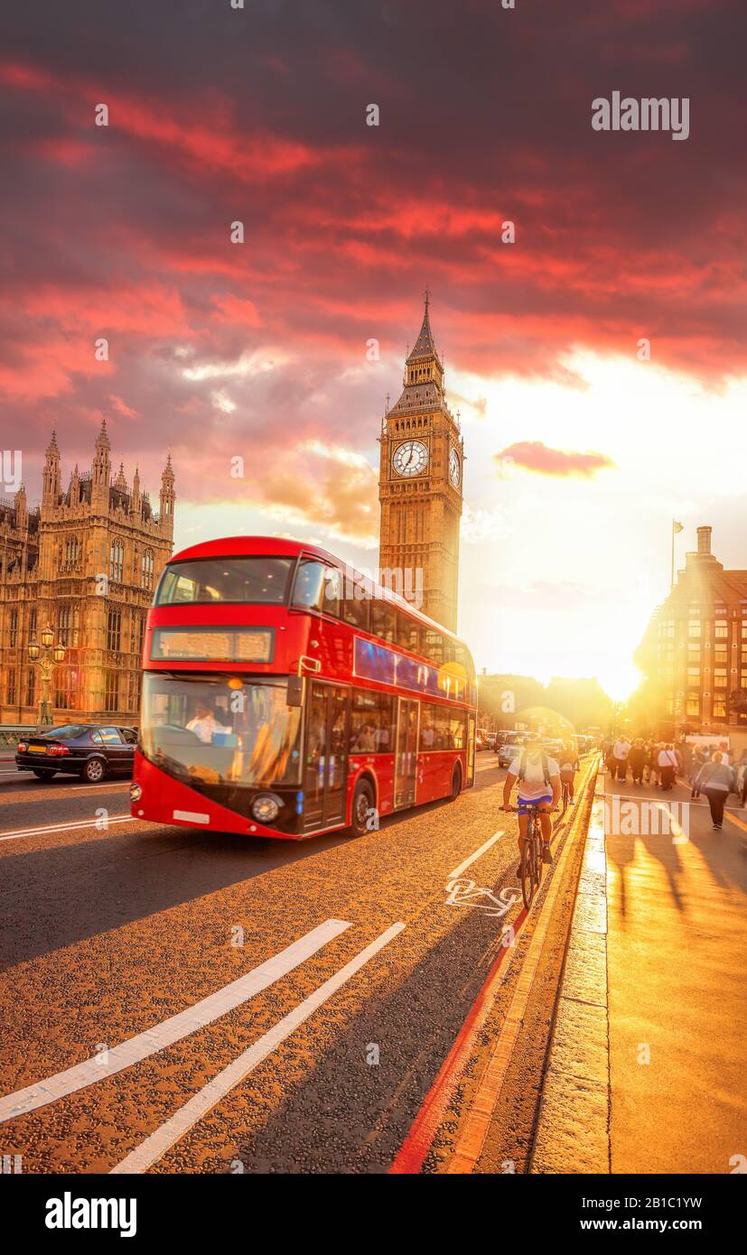 Big Ben with red bus against colorful sunset in London, England, UK ...