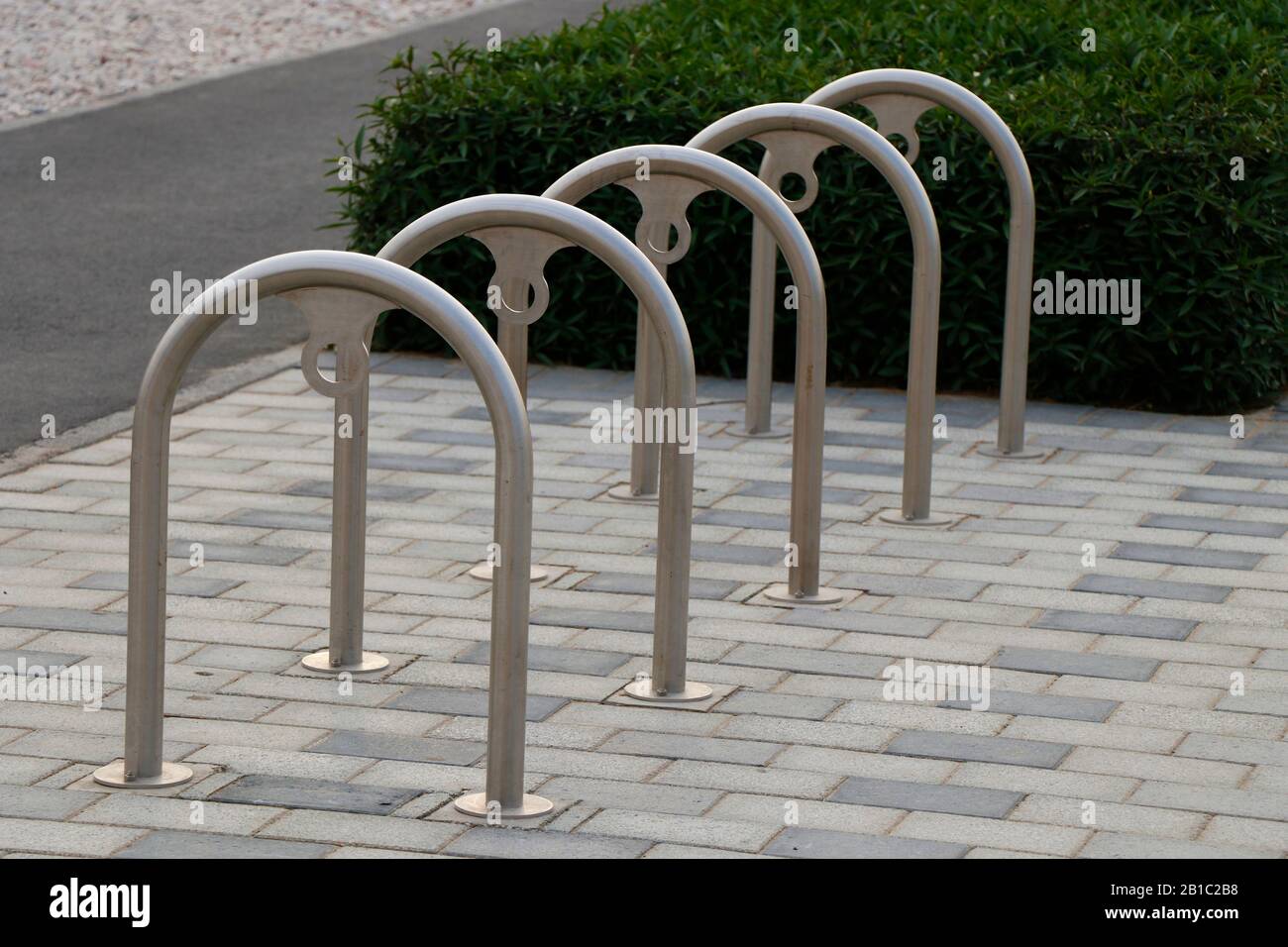 empty bicycle parking metal rack Stock Photo - Alamy