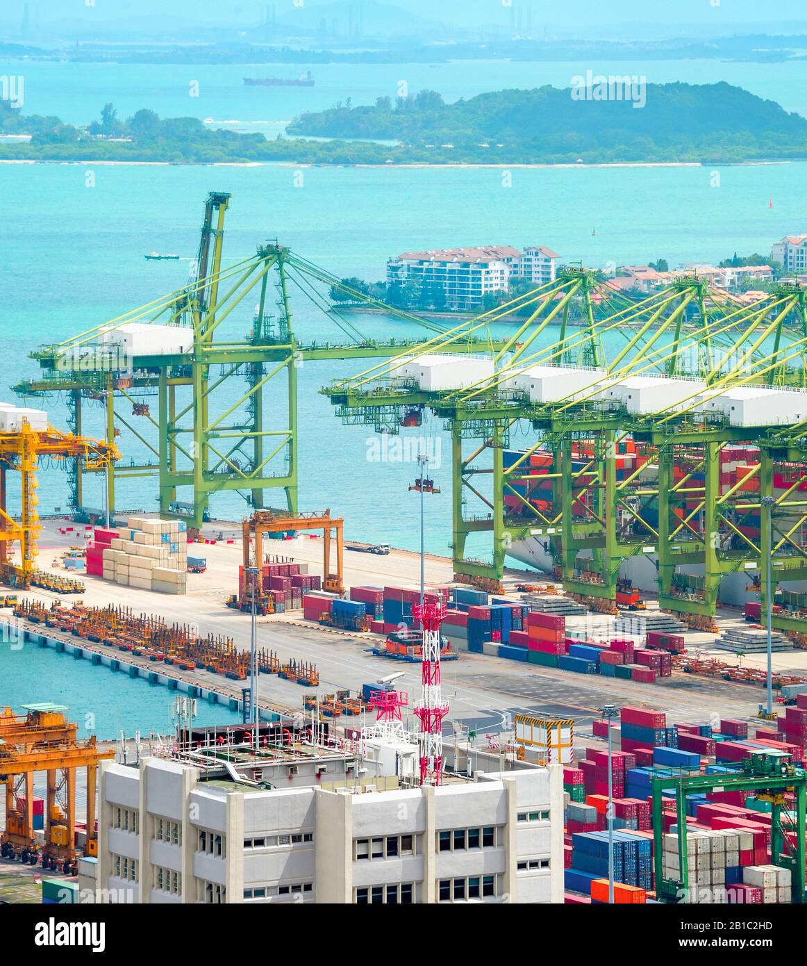 Singapore commercial port aerial view, freight cranes and containers at ...