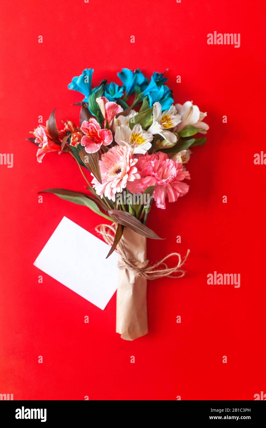 Beautiful bouquet of flowers with blank white card to put your message ...