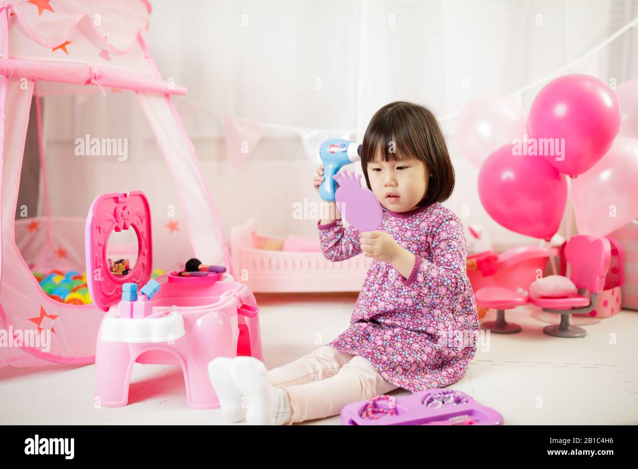 toddler girl pretend play make up at home Stock Photo - Alamy