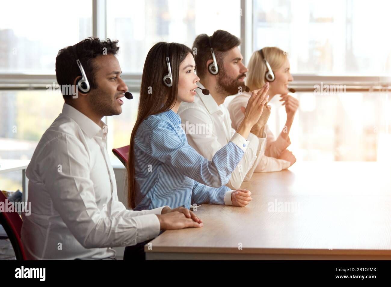 Call center female intern student raisng up hand Stock Photo - Alamy