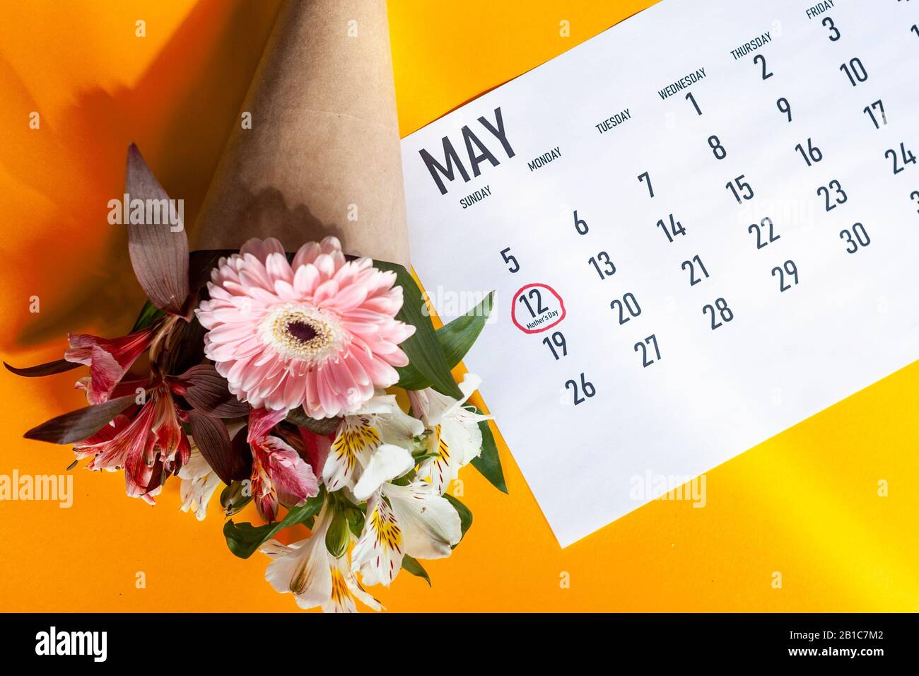A bouquet of fresh spring flowers and May monthly calendar. Mothers day ...