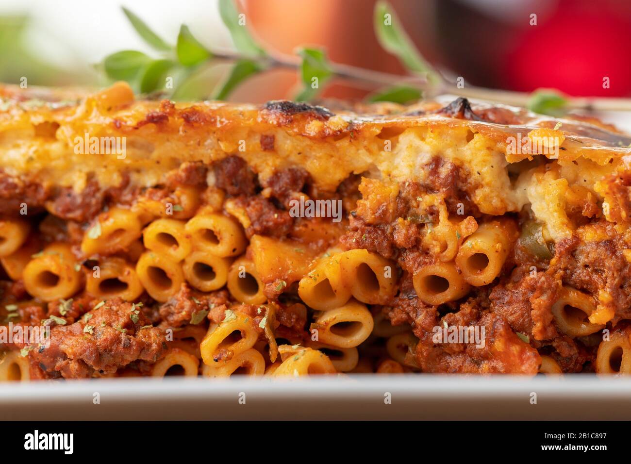 greek pastizio noodle dish with cheese Stock Photo - Alamy