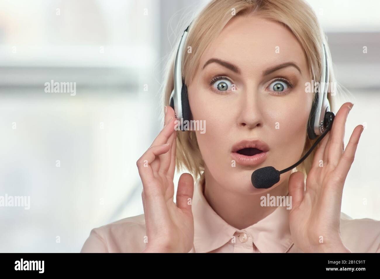 Wondering face of female call center operator Stock Photo - Alamy