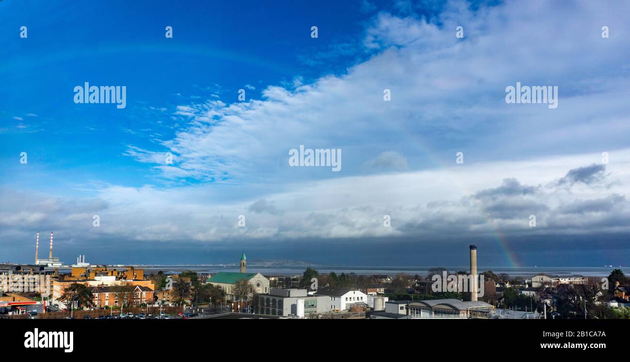 A rainbow arcs over a view of Dublin Bay, Ireland, from the Poolbeg ...