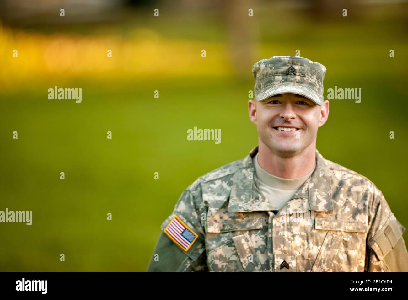 Portrait of a smiling male soldier Stock Photo - Alamy