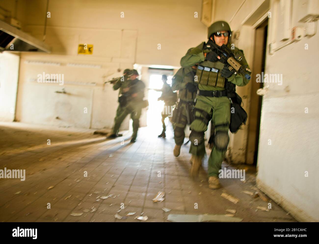 Group of police officers inside a building during an exercise at ...