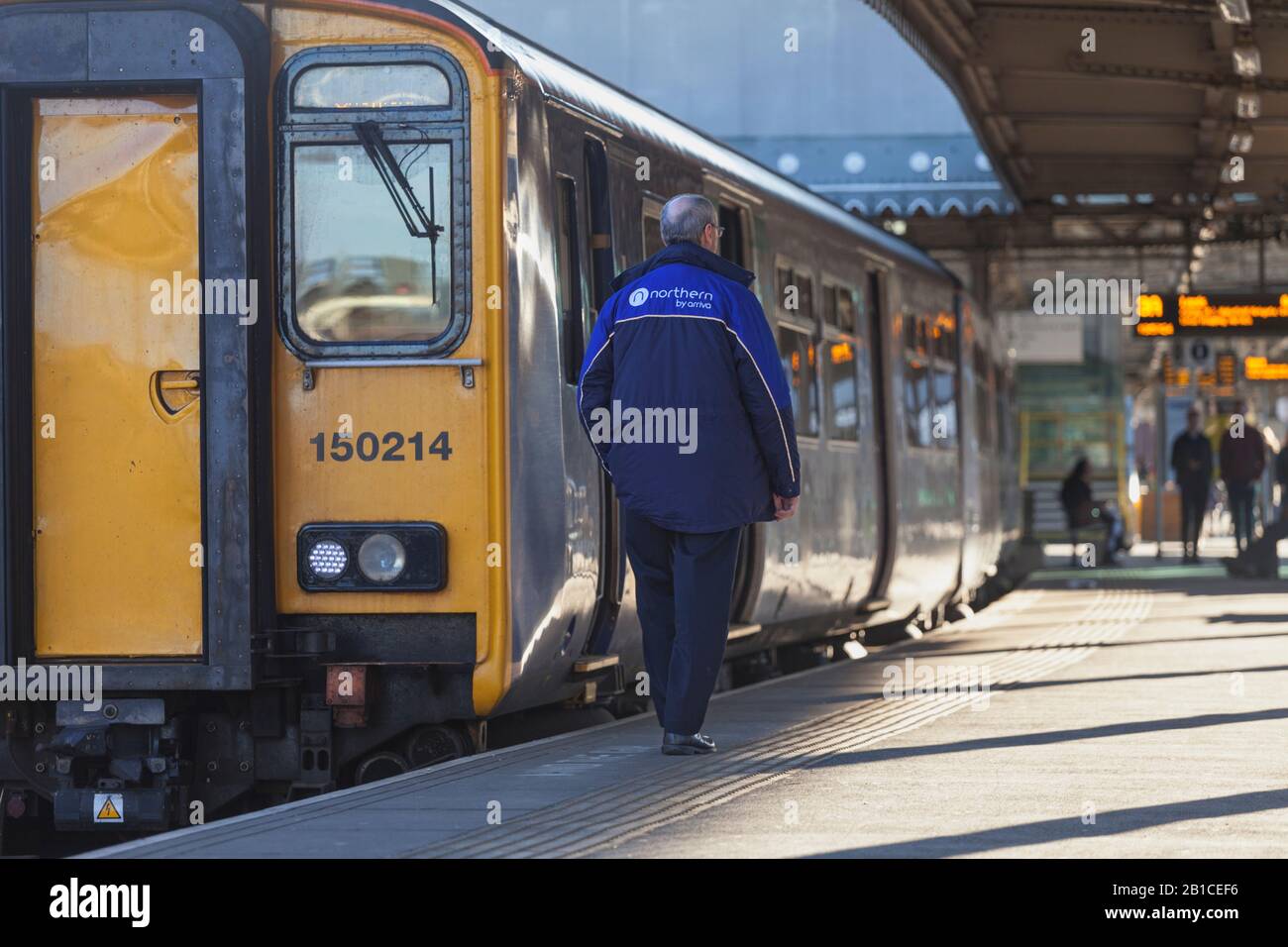 Arriva Northern rail traincrew next to a class 150 sprinter train at ...