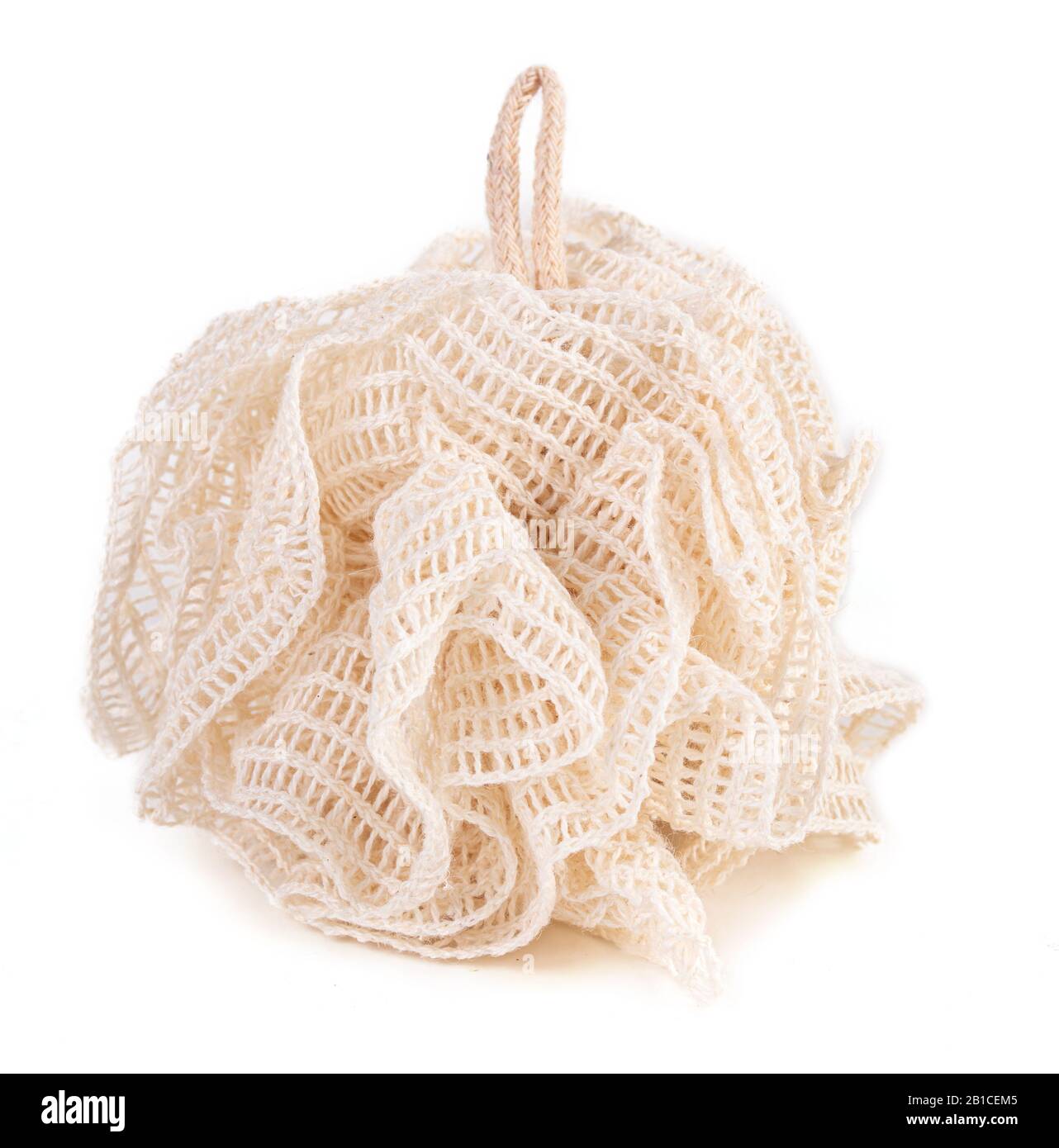 Sponge in beige fabric on white background Stock Photo - Alamy