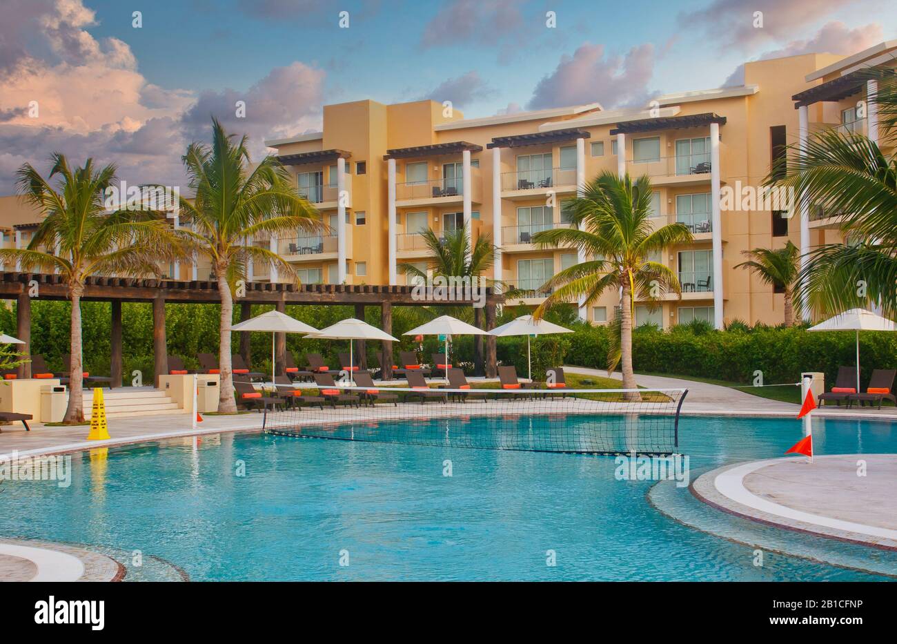 Volleyball Net Over Pool with ounges Stock Photo - Alamy