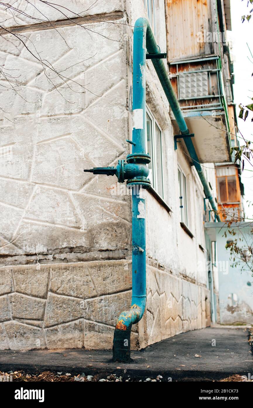 blue old natural gas pipeline installed regularly on the walls of old ...
