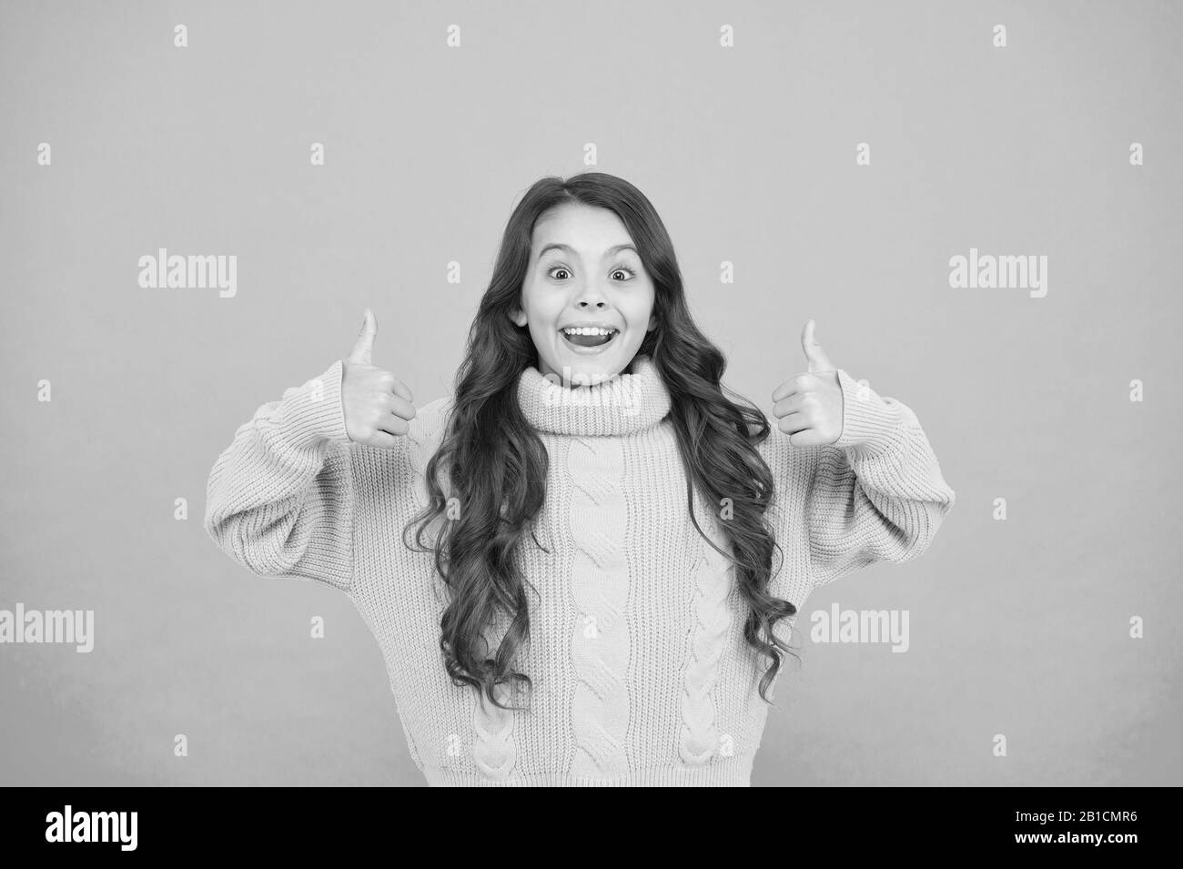 Chic snuggly style. child in casual winter fashion style. Small girl ...