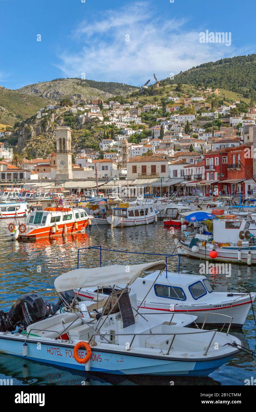 The colorful harbor town, along with fishing boats, of Hydra Island ...