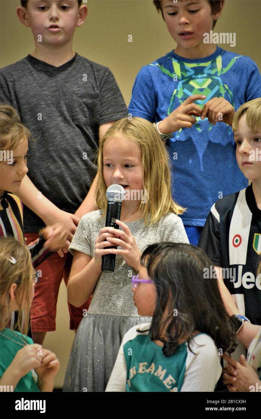 Girl speaking in school assembly hi-res stock photography and images ...