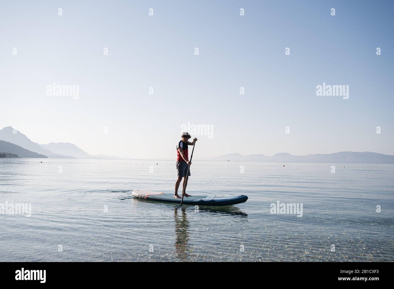 Man paddling on sup board hi-res stock photography and images - Alamy