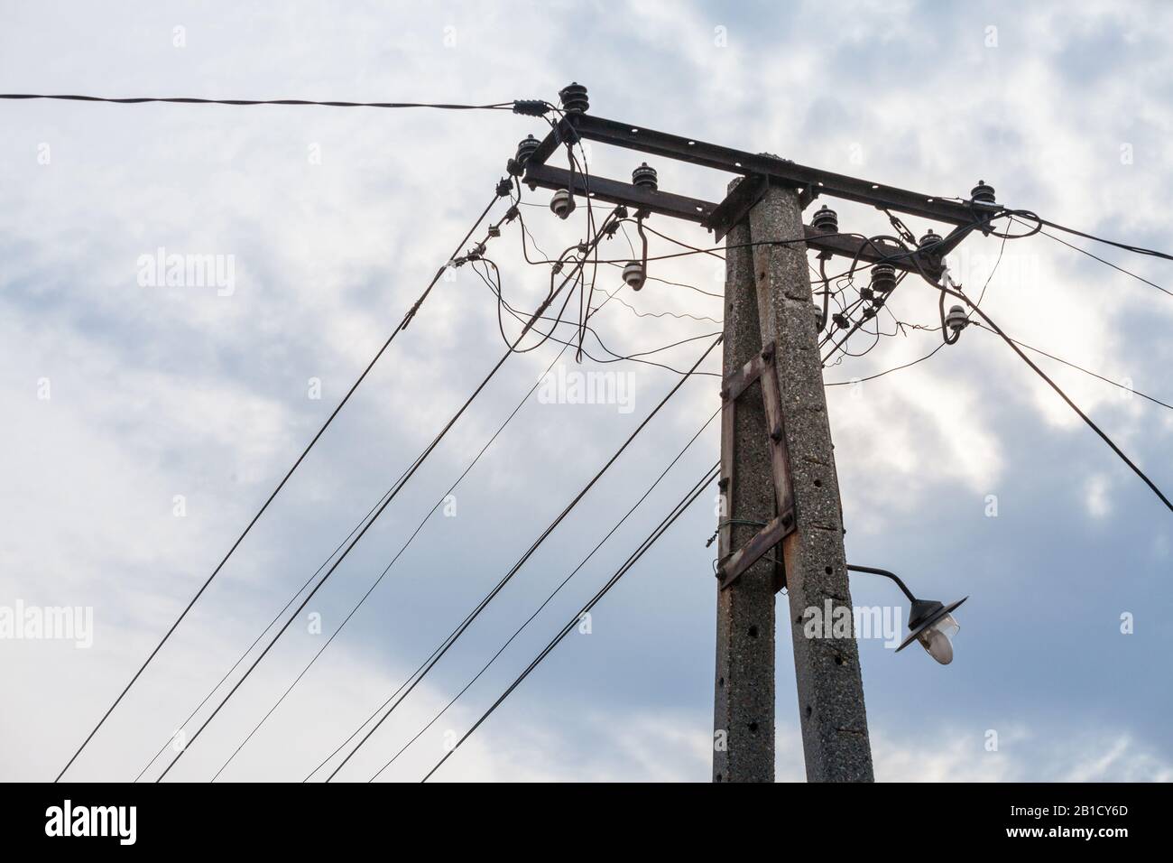 Old power electric line and a Street Lamp, with a power supply cable ...