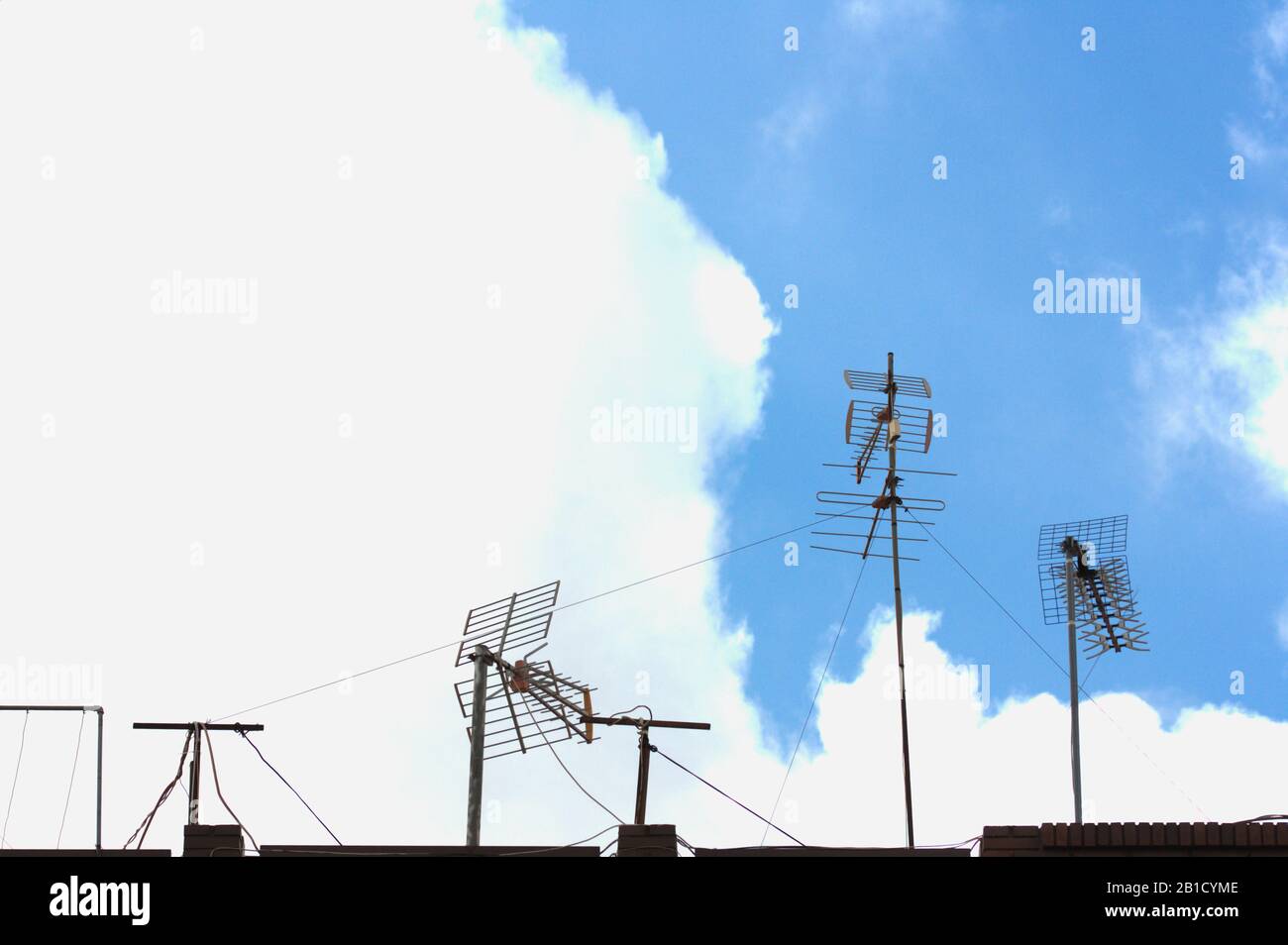 The silhouettes of antennas that tune the DTT television signal in a ...