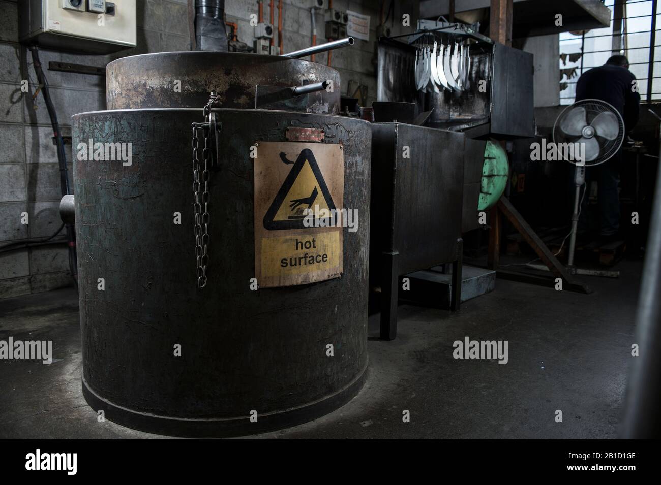 Tempering process in Knife factory. Furnace, Oil bath and draining ...