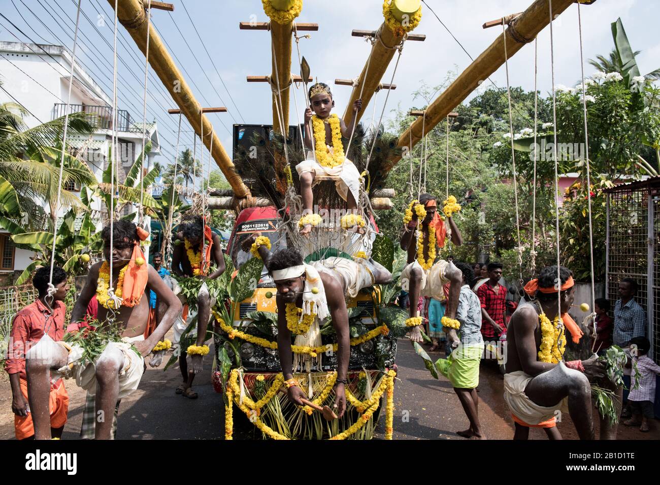 Devotees hanging by hook piercings as a ritualistic act of devotion ...
