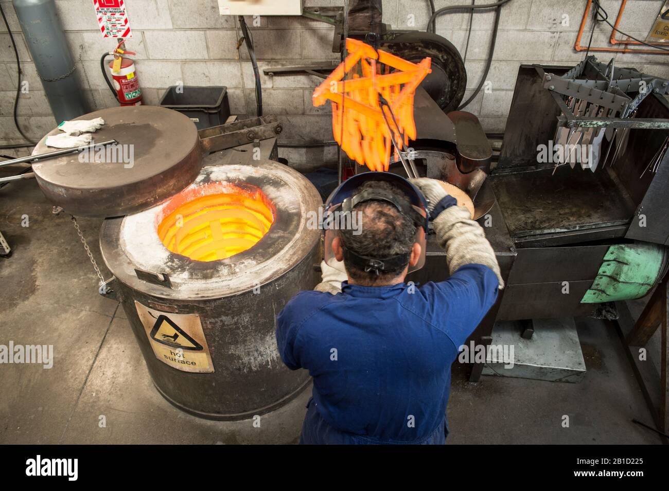 Knife blades being tempered Stock Photo - Alamy