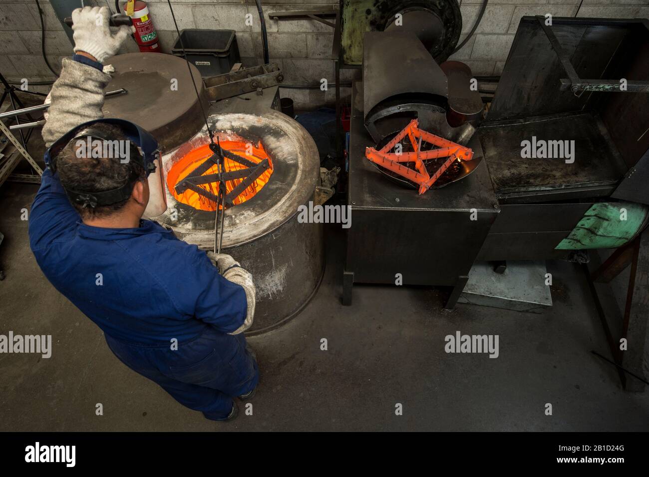 Knife blades being tempered Stock Photo - Alamy