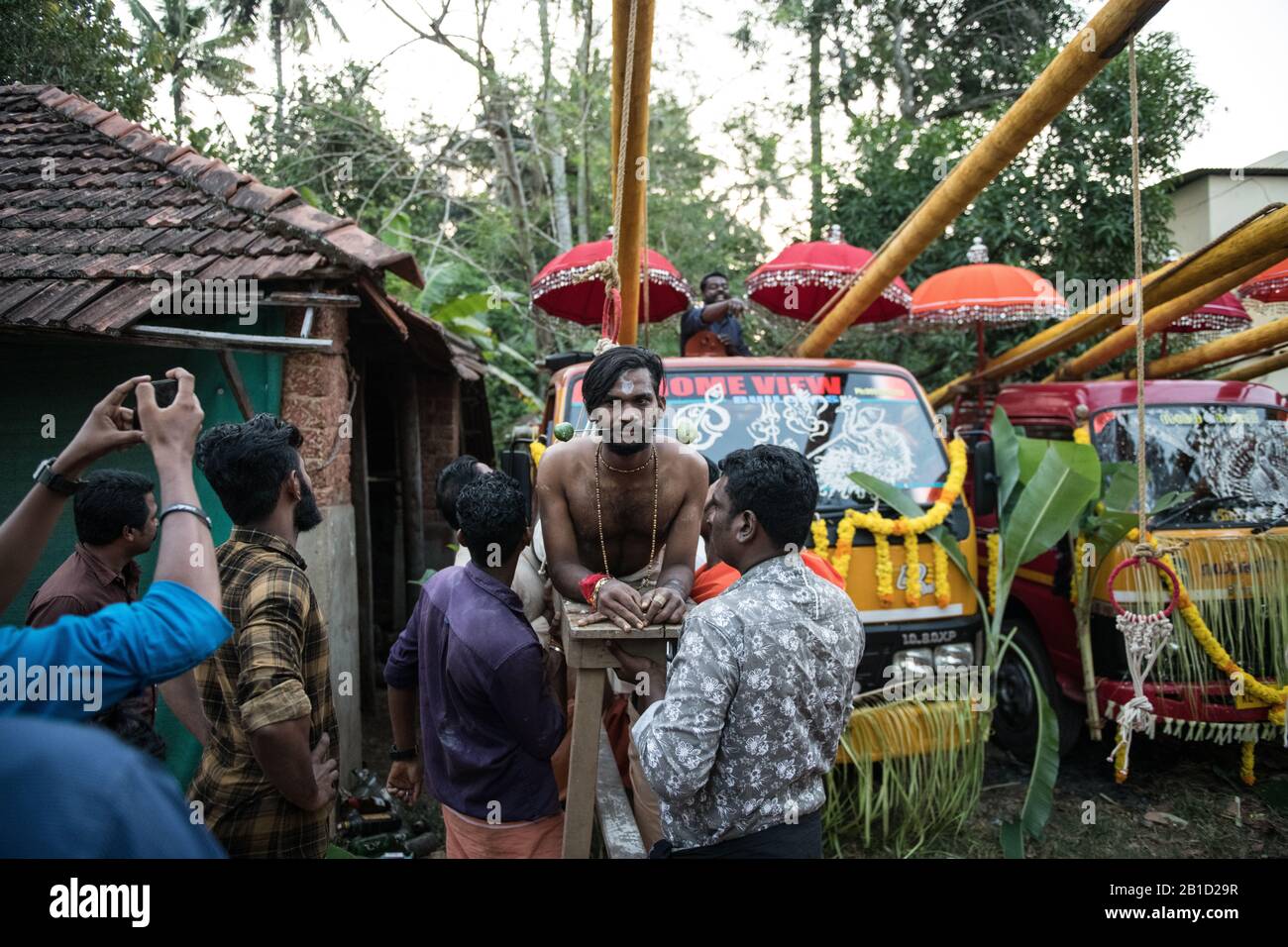 Devotee hanging by hook piercings as a ritualistic act of devotion ...