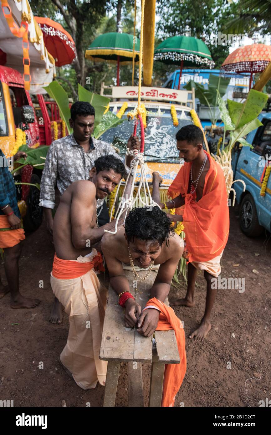 Devotee hanging by hook piercings as a ritualistic act of devotion ...