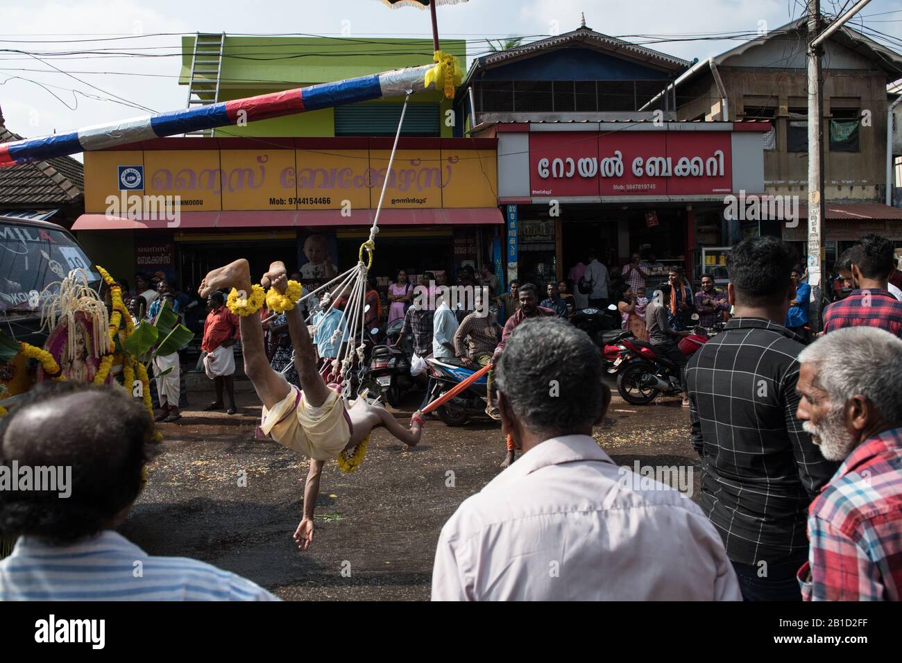 Devotee hanging by hook piercings as a ritualistic act of devotion ...
