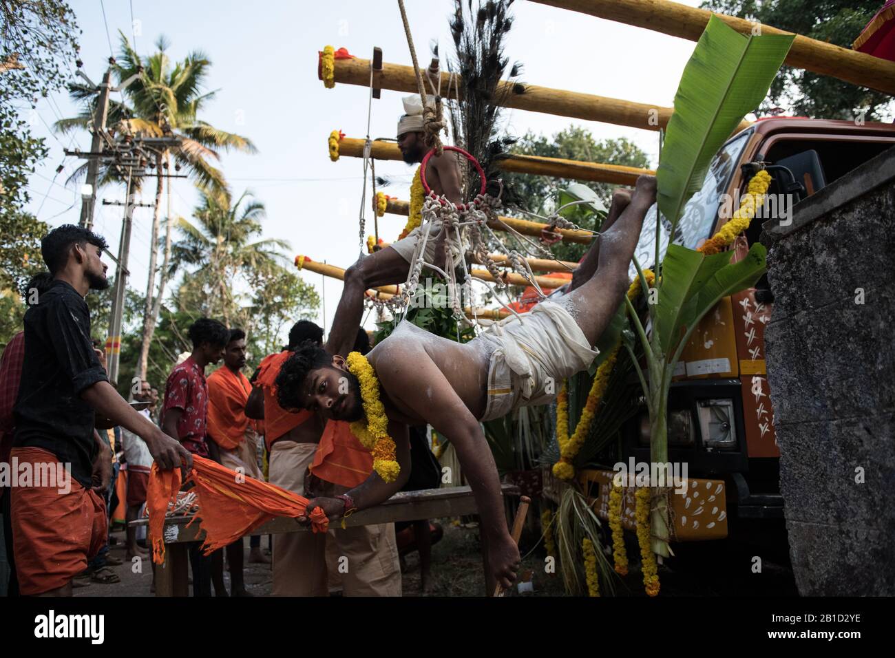 Devotee hanging by hook piercings as a ritualistic act of devotion ...
