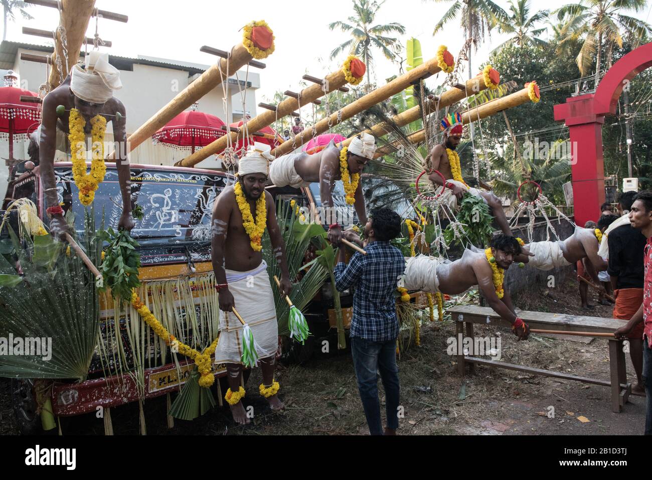 Devotees hanging by hook piercings as a ritualistic act of devotion ...