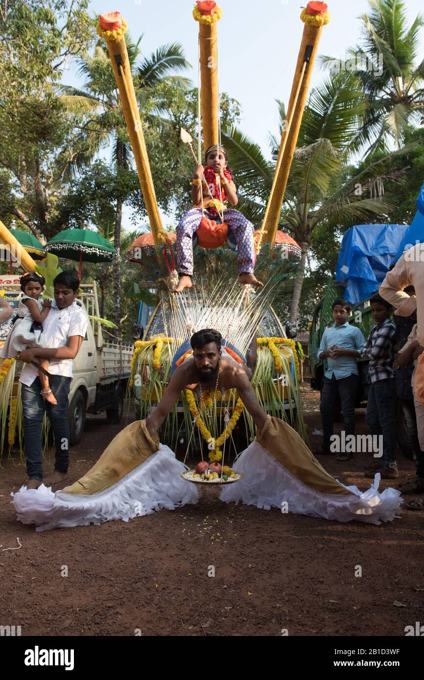 Devotee hanging by hook piercings as a ritualistic act of devotion ...