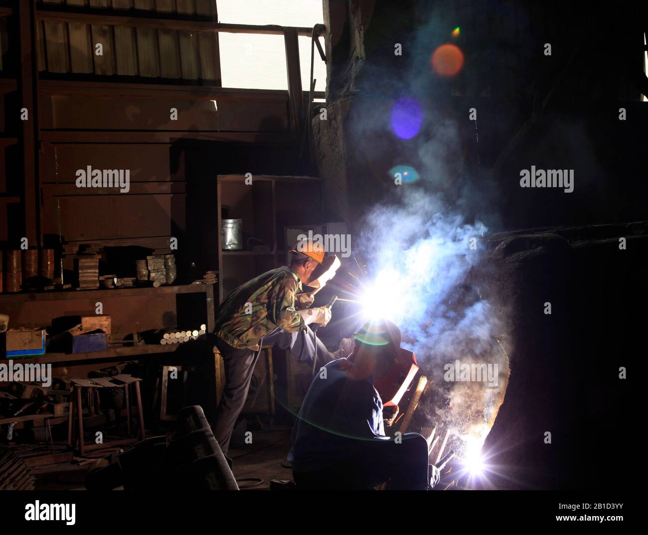 In the steel mill workshop, welding workers are working Stock Photo - Alamy