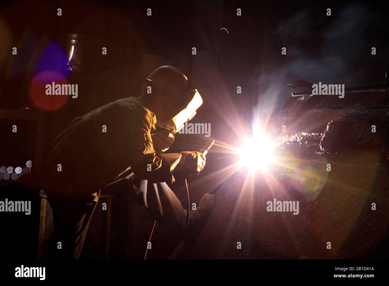 In the steel mill workshop, welding workers are working Stock Photo - Alamy