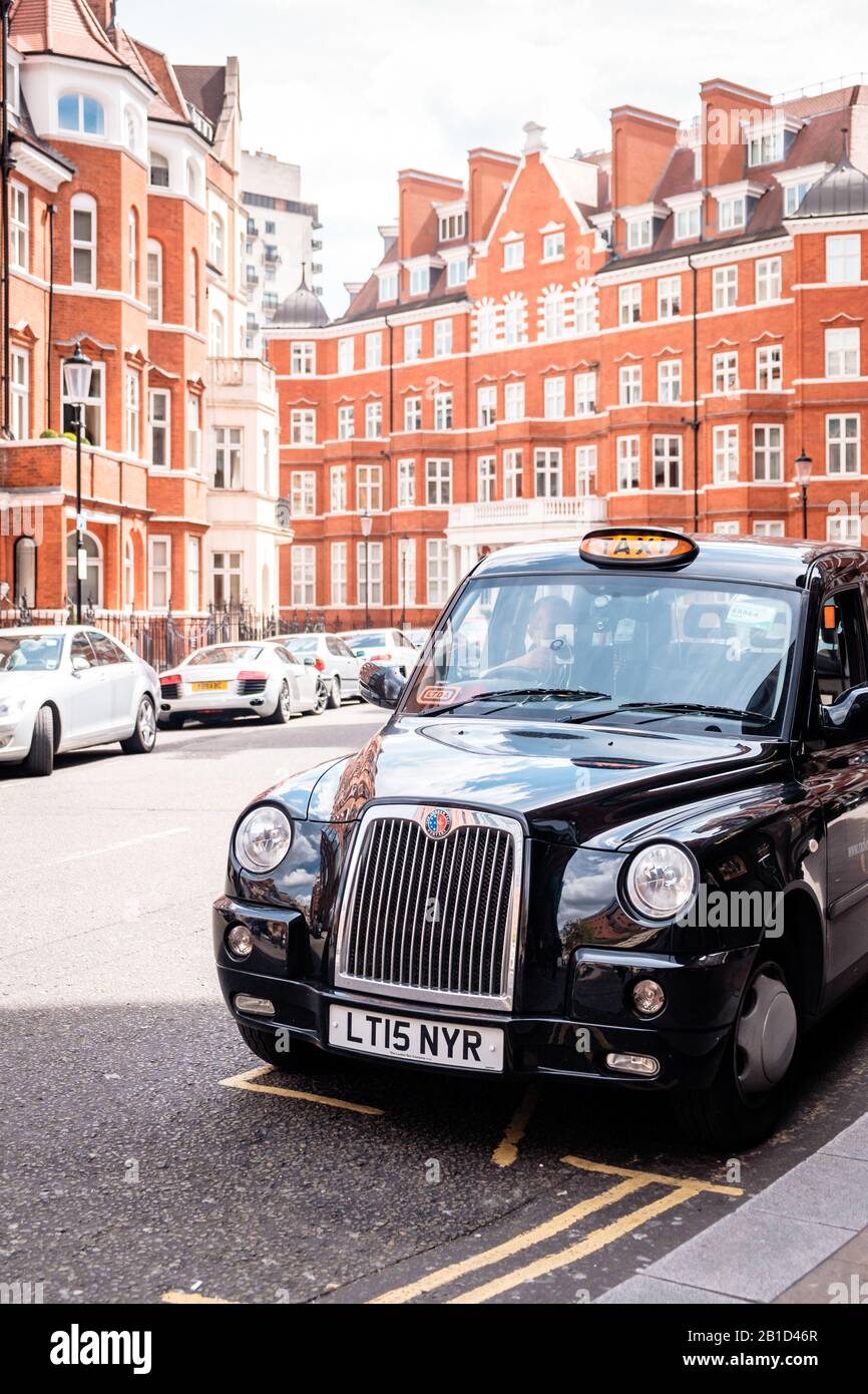 London taxi driver waiting for a passenger, Knightsbridge, London ...