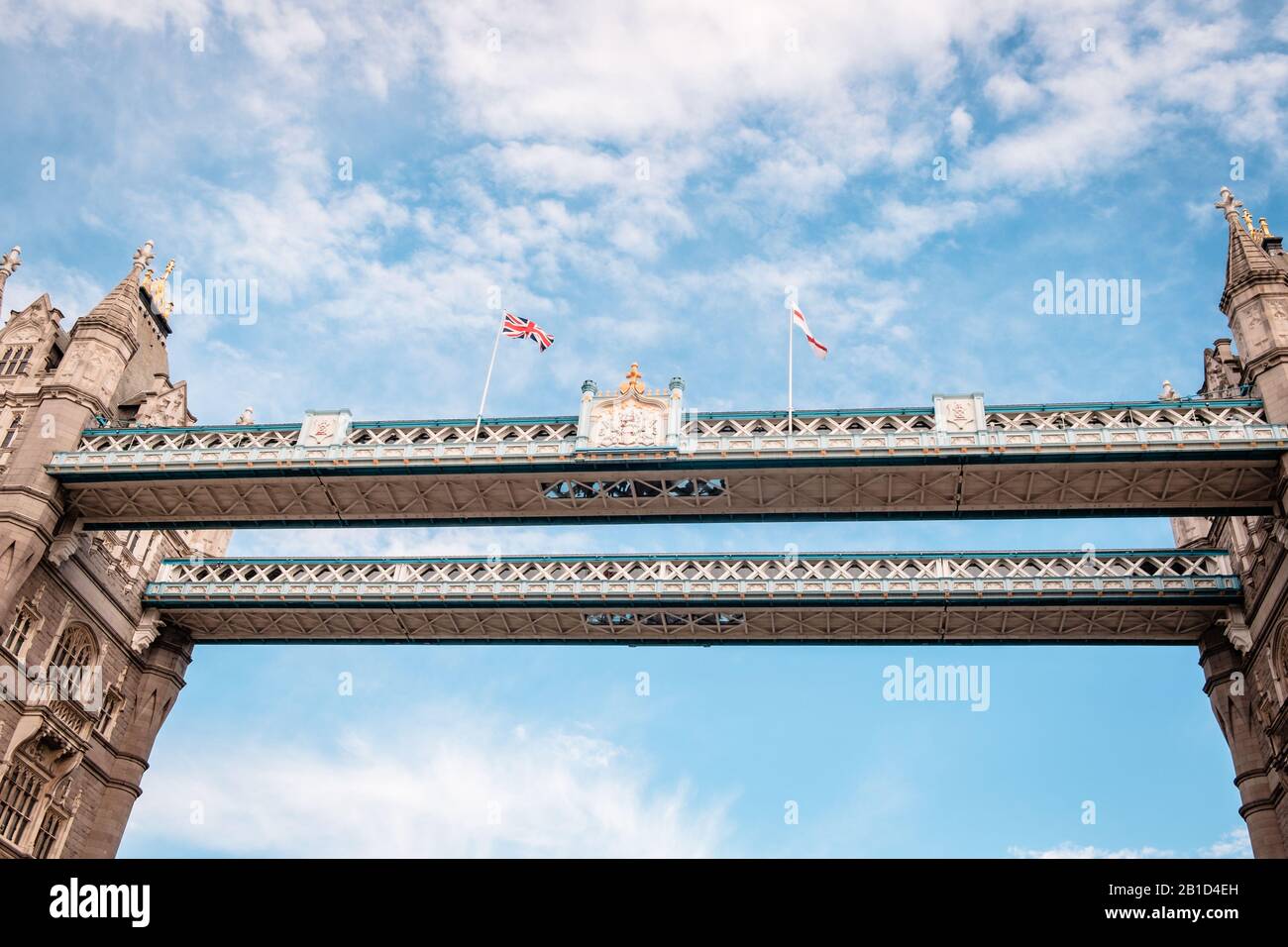 Flags hoisted on upper deck walkway of Tower Bridge, London, England ...